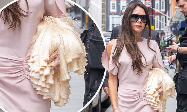 Victoria Beckham displays her svelte frame in a pink midi dress - Hot ...